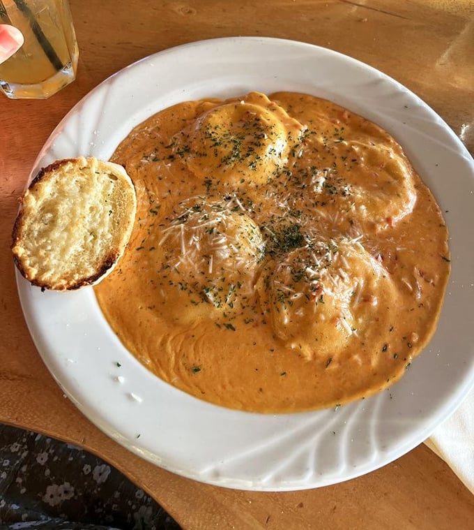 Lobster ravioli swimming in a sunset-colored cream sauce&mdash;pasta pillows filled with treasures from the deep that make you want to dive right in.