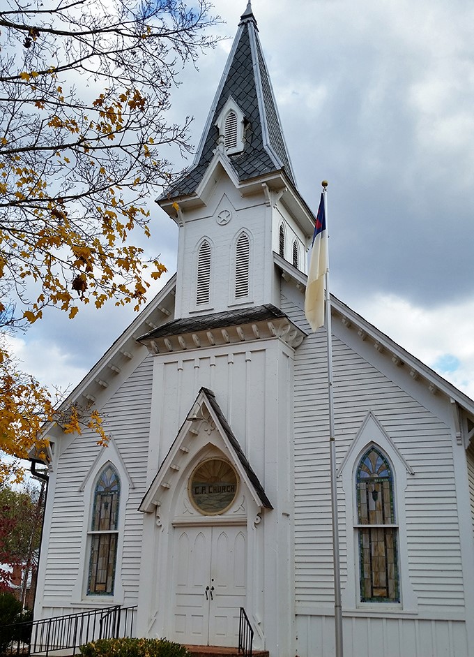 This pristine white church has witnessed more community history than any history book could contain. Fall foliage provides the perfect backdrop.