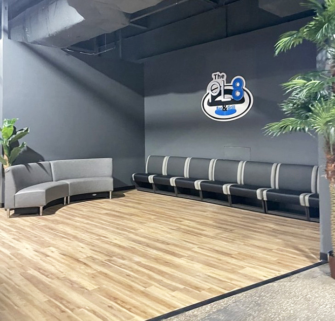 The sleek lounge area provides a moment of calm amid the excitement, where comfortable seating invites weary players to rest before the next round of fun.