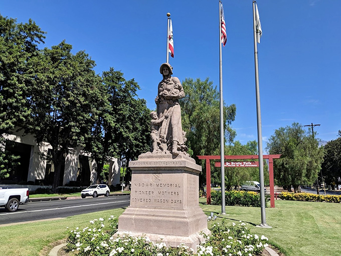 The Madonna of the Trail statue honors pioneer women who conquered the frontier with babies on hips and determination in their hearts.