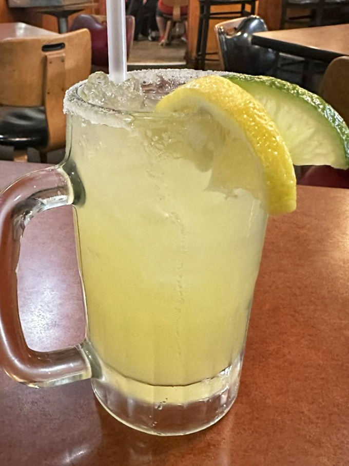 A margarita that looks like liquid sunshine served in a mug built for serious sipping.