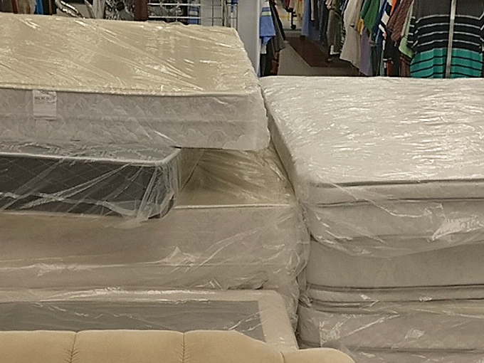 Mattress mountain! Someone's perfect night's sleep is waiting in this plastic-wrapped collection of pre-loved dreamscapes.