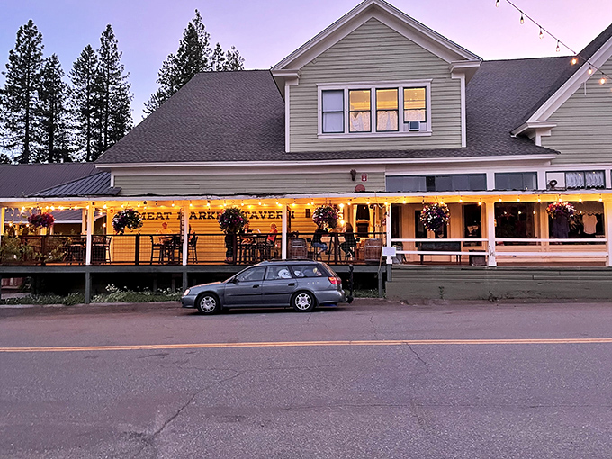 The Great Market Tavern lights up as dusk falls, transforming from daytime eatery to evening gathering spot where locals and visitors swap tall tales.
