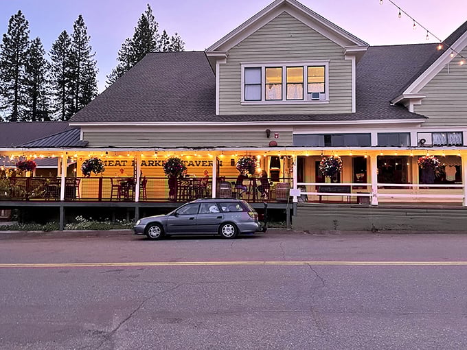 The Meat Market's wraparound porch invites lingering conversations as twilight transforms Main Street into a Norman Rockwell painting come to life.
