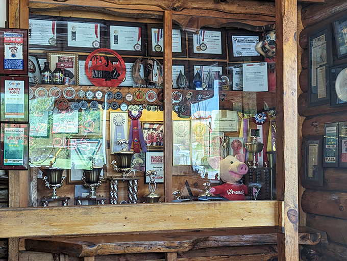 A trophy case that tells the story of smoke, patience, and barbecue glory. Each award earned through wood, fire, and time.