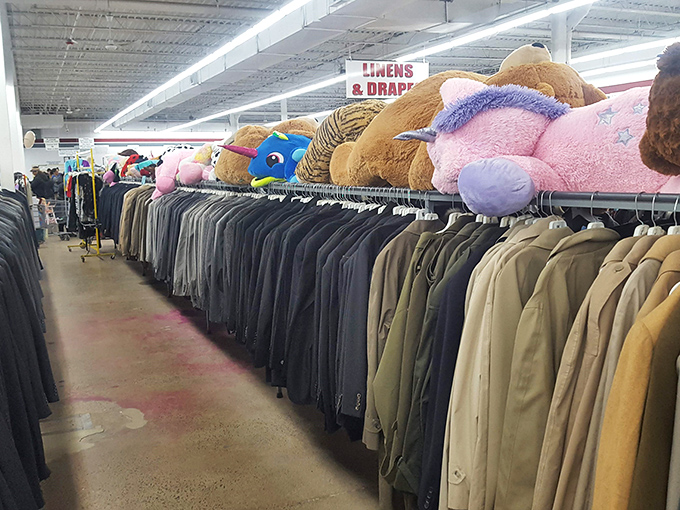 The men's department offers both business and casual options, while plush guardians keep watch from their lofty perch above.