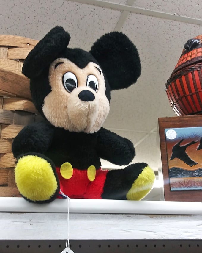 Mickey's vintage smile hasn't dimmed with age. This plush piece of Disney history waits patiently for its next adventure.