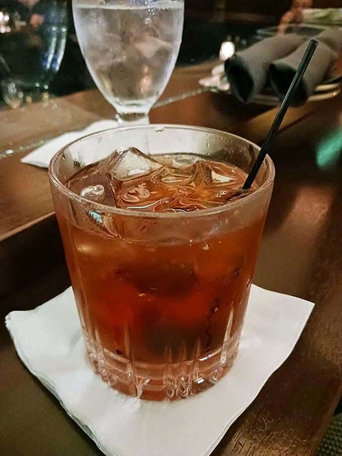 An amber-hued Old Fashioned sits in cut crystal, ice slowly melting into what might be Minnesota's perfect cocktail.