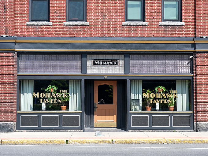 The Mohawk Tavern's understated facade belies the warm welcome inside, where locals gather for conversations that couldn't happen on any social media platform.