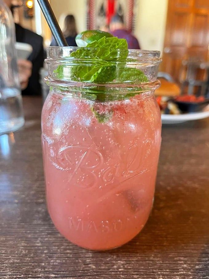 This rosy mojito, garnished with fresh mint, offers a vacation in a Mason jar regardless of the season.