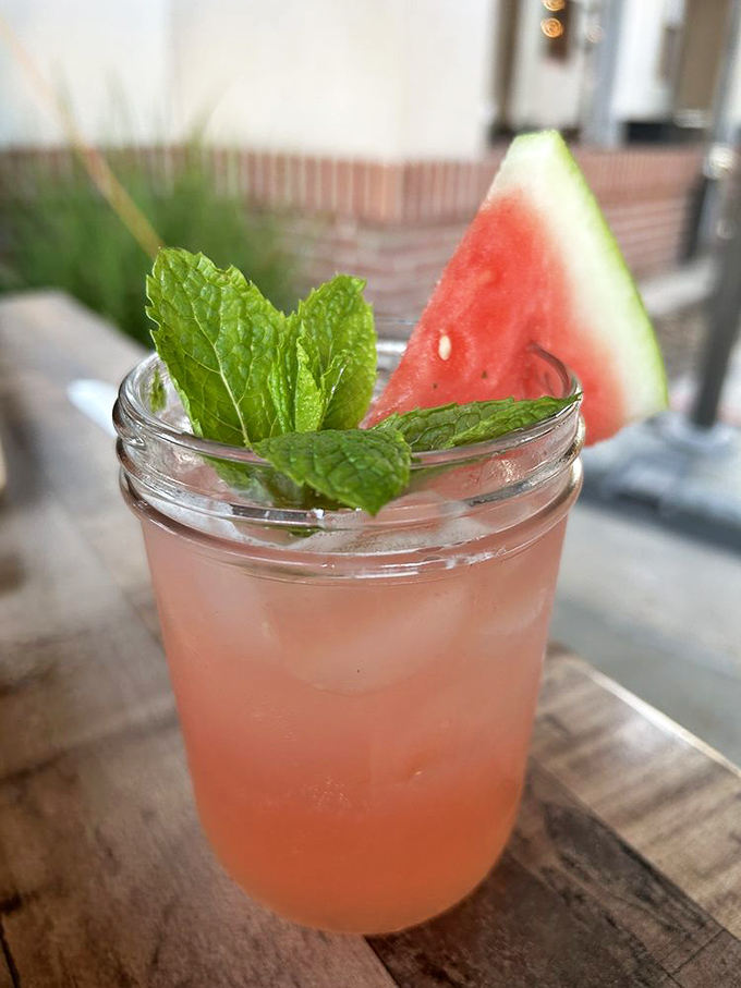 A watermelon cocktail garnished with mint &ndash; summer in a glass that whispers, "Yes, you can be refreshed while eating half your weight in brisket."