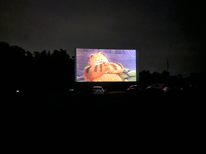 When darkness falls completely, Garfield's orange glow illuminates a sea of vehicles united by nothing more than geography and storytelling.