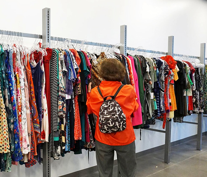 The rainbow of dresses offers everything from casual Friday to wedding guest attire. That backpack shopper knows the thrill of the hunt all too well.