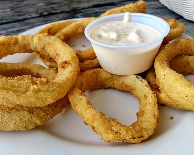 Onion rings aren't just appetizers here &ndash; they're golden halos of happiness. Crispy, light, and begging for that dipping sauce.