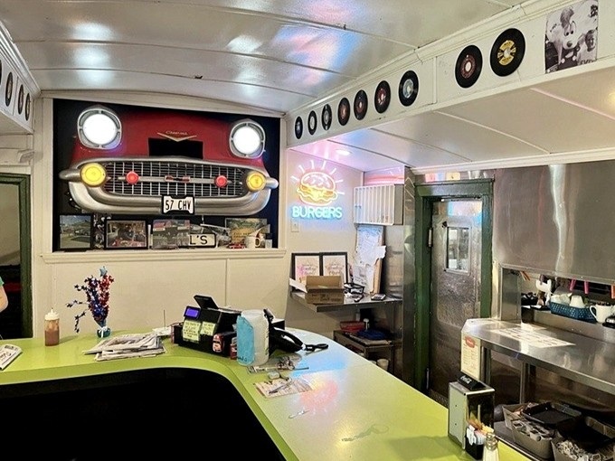 The lime-green counter offers front-row seats to the breakfast show, where eggs sizzle and toast pops with perfect theatrical timing every morning.