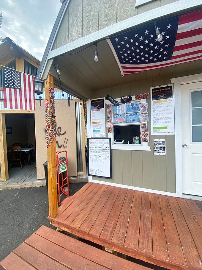 Where BBQ dreams come true, one order at a time. The American flags and handwritten menu speak to the no-frills authenticity that makes this place special.