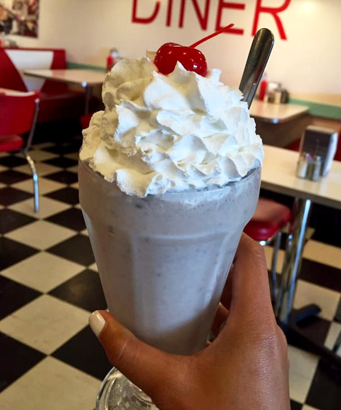 This isn't just a milkshake; it's dessert in a glass &ndash; topped with a cloud of whipped cream and that essential cherry exclamation point.