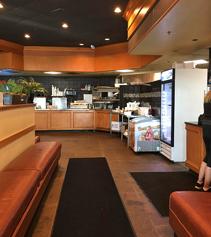 The open kitchen layout lets you witness culinary magic happening in real-time&mdash;like watching a delicious reality show with guaranteed happy endings. 