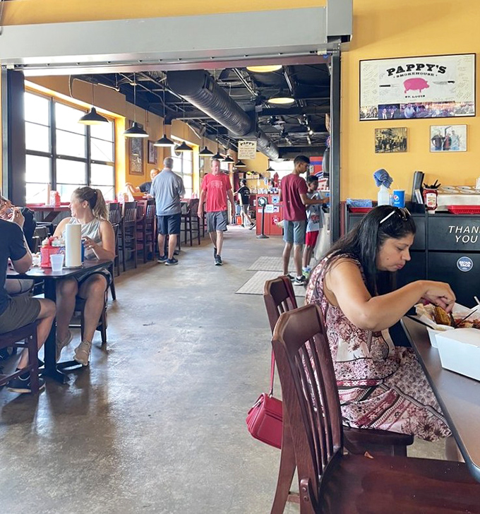 The dining room buzzes with the universal language of BBQ appreciation&mdash;nodding heads, closed eyes, and the occasional "mmm" escaping between bites.