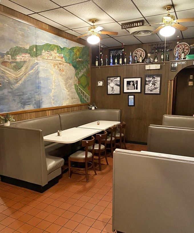The cozy booths and Italian landscape mural create that perfect "I've discovered somewhere special" feeling that makes you want to keep it secret.