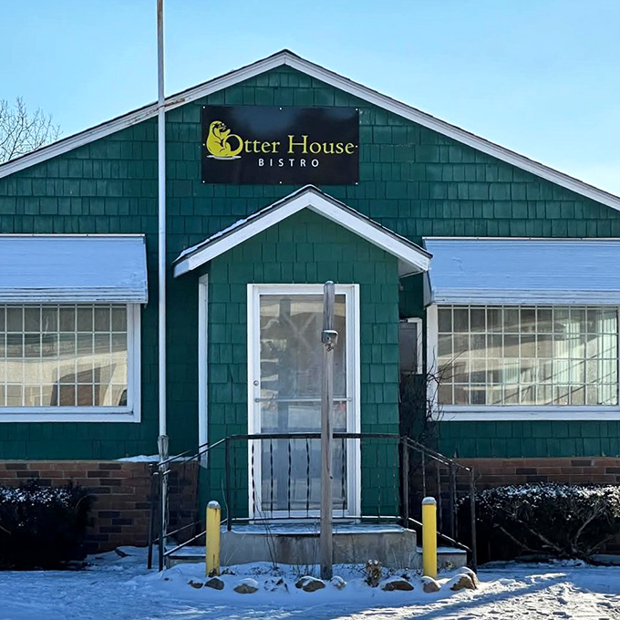 The Otter House Bistro wears winter like a cozy sweater. That dusting of snow isn't inconvenient—it's nature's way of adding ambiance.