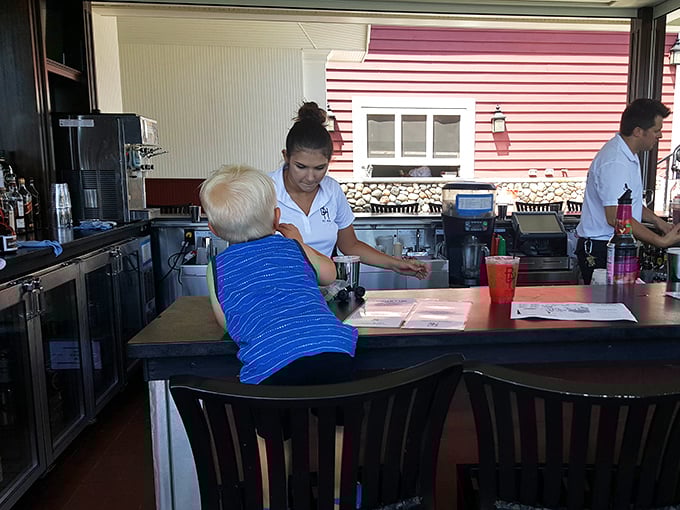 An outdoor bar with a view that makes even the most ordinary beer taste like it was brewed by angels specifically for this moment.