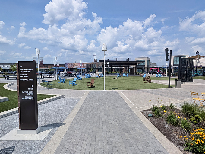 A central green space offers a moment of retail reprieve. Those Adirondack chairs practically beg you to rest your shopping-weary feet.