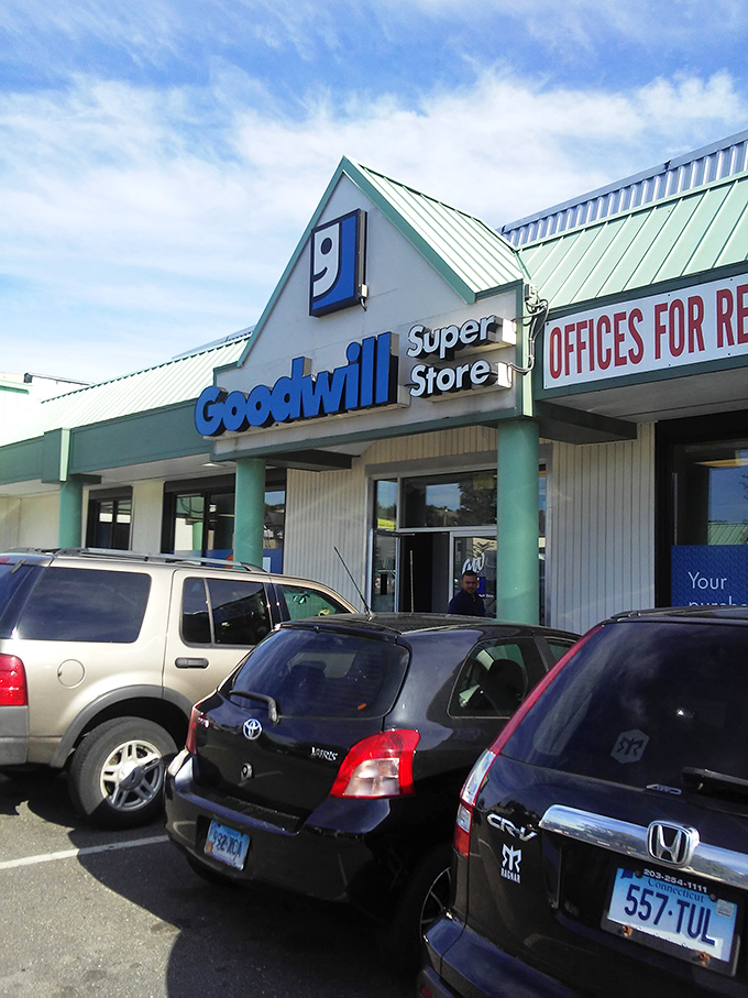 A busy parking lot signals treasure hunters are on the prowl, each car representing someone's quest for that perfect thrifted find.
