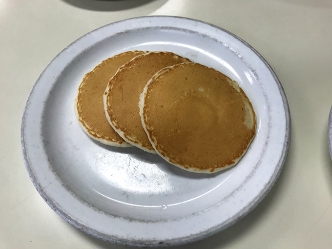 Three perfect pancakes await their maple destiny&mdash;golden discs of comfort that somehow taste like childhood memories regardless of where you grew up.