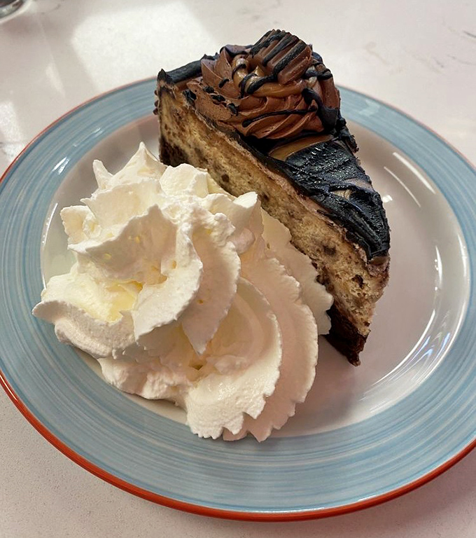 This isn't just dessert – it's therapy with whipped cream. The peanut butter cheesecake doesn't ask about your problems, it solves them.