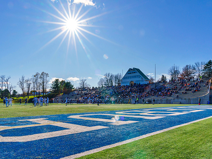 Game day at Middlebury College draws fans to hillside seats&mdash;nature's stadium where the fall foliage provides a more spectacular show than any Jumbotron.