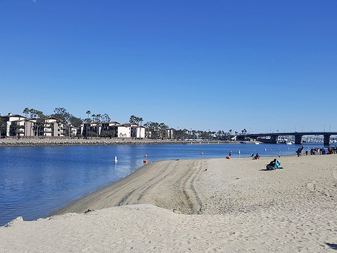 The calm bay waters make this beach feel less "battle the waves" and more "actually enjoy the water."