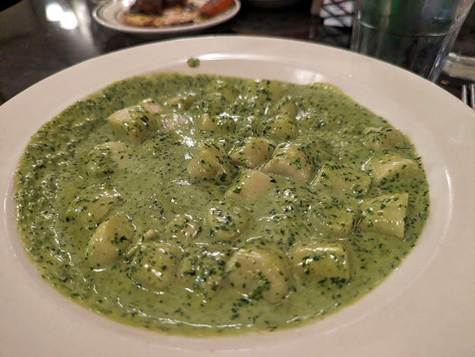 Gnocchi in pesto sauce: little potato pillows lounging in a vibrant green bath that tastes like summer in the Italian countryside.