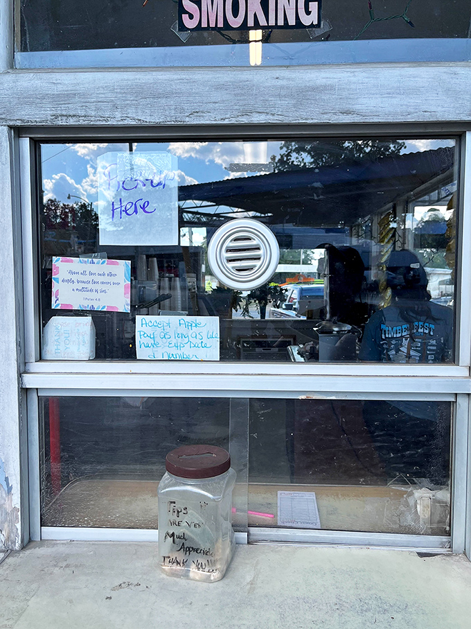 Handwritten signs and tip jars speak volumes about small-town charm—where "Order Here" means "Welcome to our community."