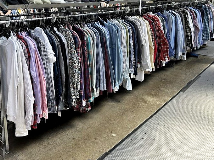 The men's section – a rainbow of possibilities. Like a perfectly organized spice rack, these shirts await the discerning eye of a style chef.