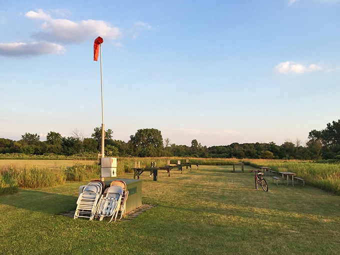 This prairie outpost with its wind sock stands ready for adventurers. Like an airport for outdoor enthusiasts, minus the overpriced coffee.