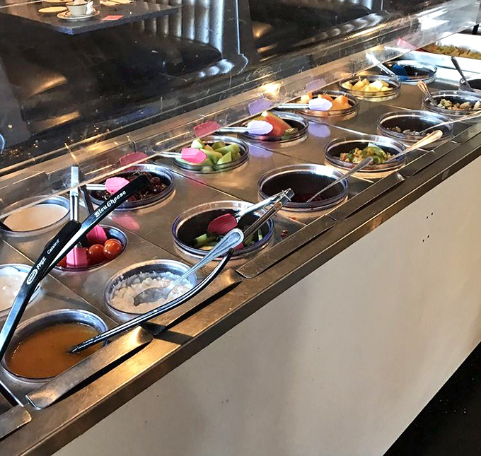 The salad bar&mdash;mission control for healthy options. Each compartment offers fresh ingredients for creating your own edible galaxy.