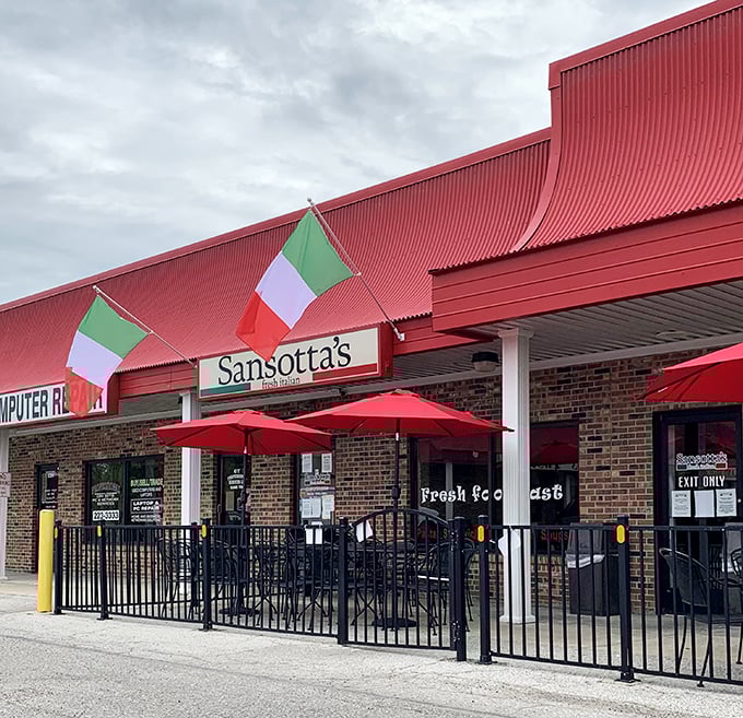 Sansotta's red umbrellas invite you to savor authentic Italian flavors on their patio &ndash; a little slice of Mediterranean warmth in the Midwest.
