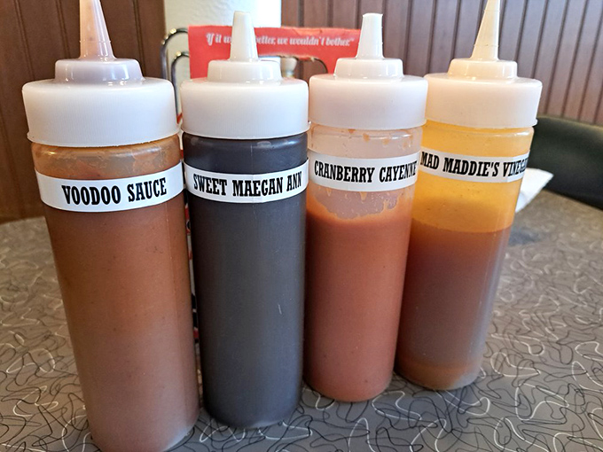 Sauce personality test: Choose your fighter! From Voodoo heat to Sweet Maegan Ann's embrace, these squeeze bottles hold liquid personality traits waiting to enhance your meat.