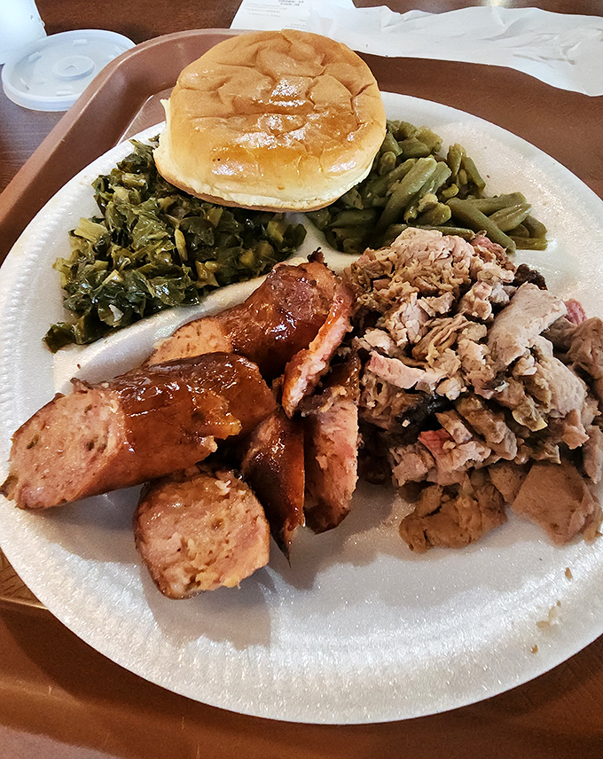 The barbecue sampler of your dreams &ndash; sausage, pulled pork, greens, and a bun that's ready to soak up every last drop.