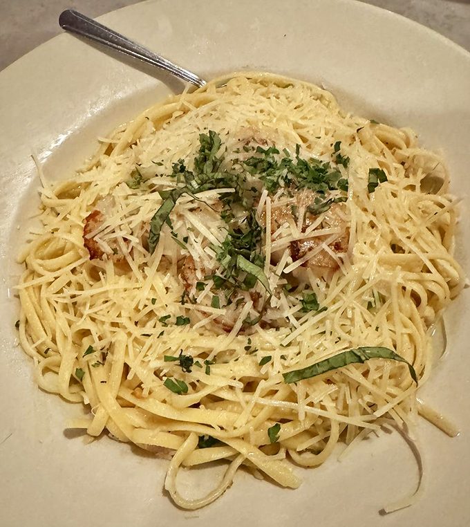 Pasta perfection with a Maine accent&mdash;tender scallops nestled among strands of linguini like pearls in a creamy ocean of flavor.