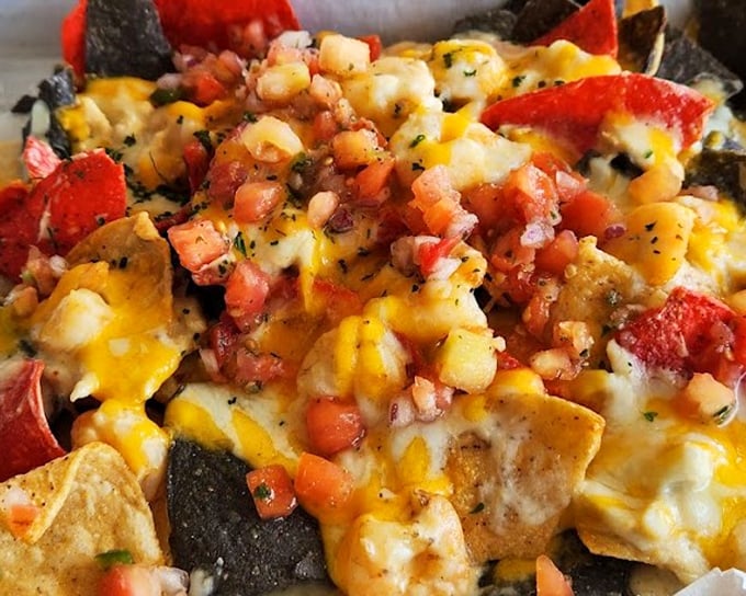 Seafood nachos that throw the rulebook out the window in the most delicious rebellion imaginable. Who knew tortilla chips could make such sophisticated friends?
