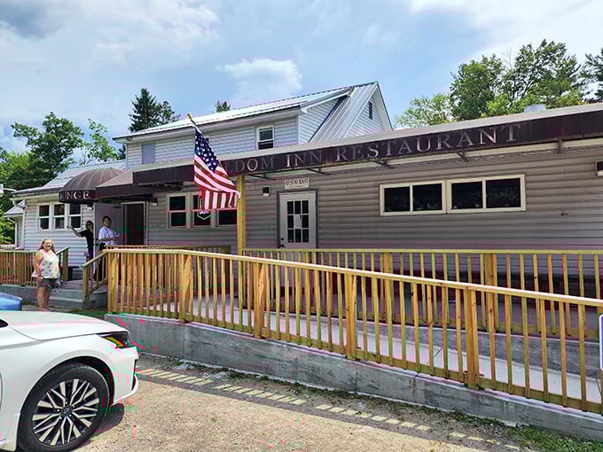 The Freedom Inn Restaurant's wooden deck and American flag welcome hungry travelers with the promise of home-cooked Pennsylvania comfort food.