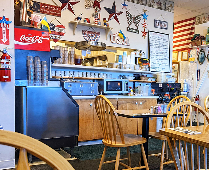 The service counter decorated with Americana proves this place celebrates straightforward American comfort food with genuine pride and enthusiasm.