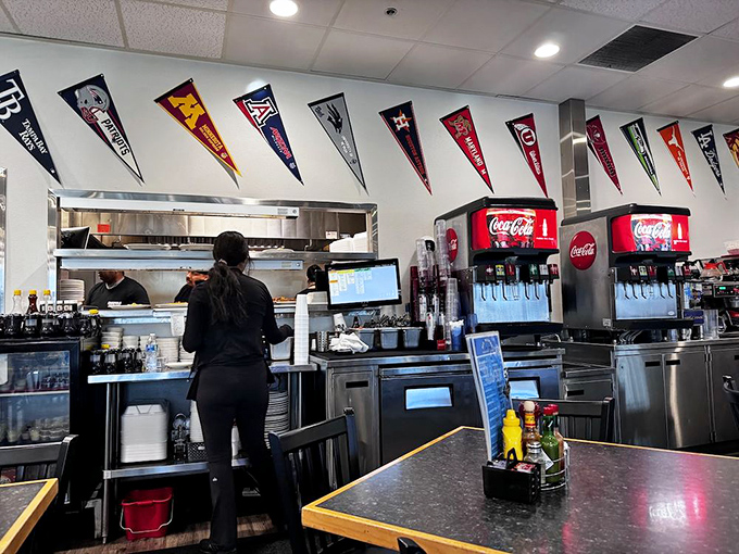 The service counter buzzes with efficiency, where soda fountains stand ready and staff orchestrate the breakfast symphony behind the scenes.