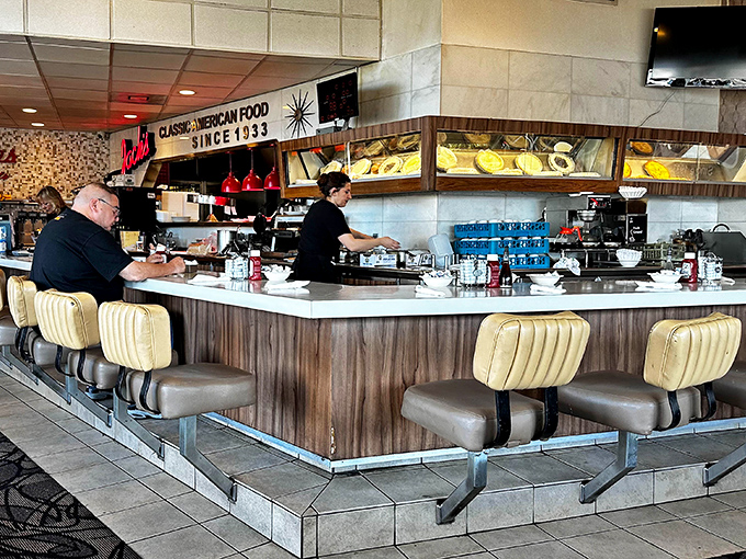 Counter seating: where solo diners become regulars and servers remember your order before you sit down. The heart of diner culture.