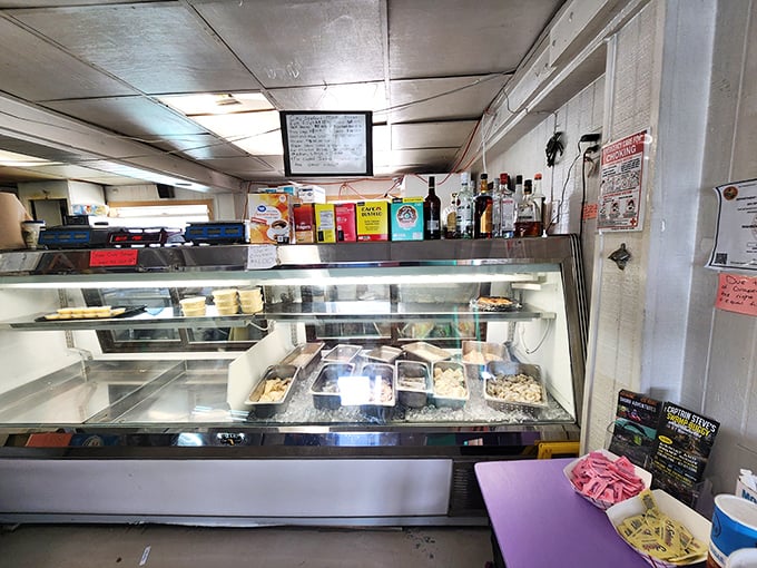 Behind this humble counter, seafood magic happens. The display case holds treasures fresher than your morning newspaper.