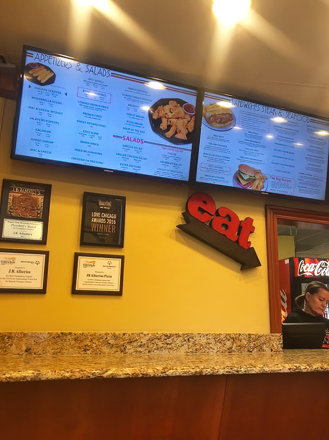 Awards on the wall and a giant "eat" sign&mdash;as if you needed any more encouragement to do exactly that.