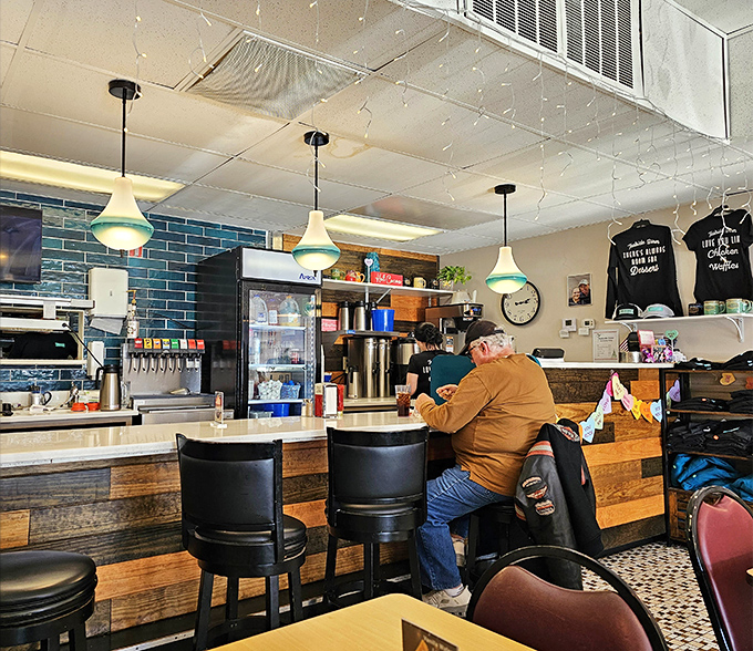 The counter where breakfast dreams come true, backed by that signature teal and rustic wood that gives Tealside its distinctive character.