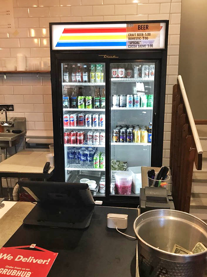 The service counter where barbecue dreams come true, complete with a menu board that reads like a love letter to smoked meats.